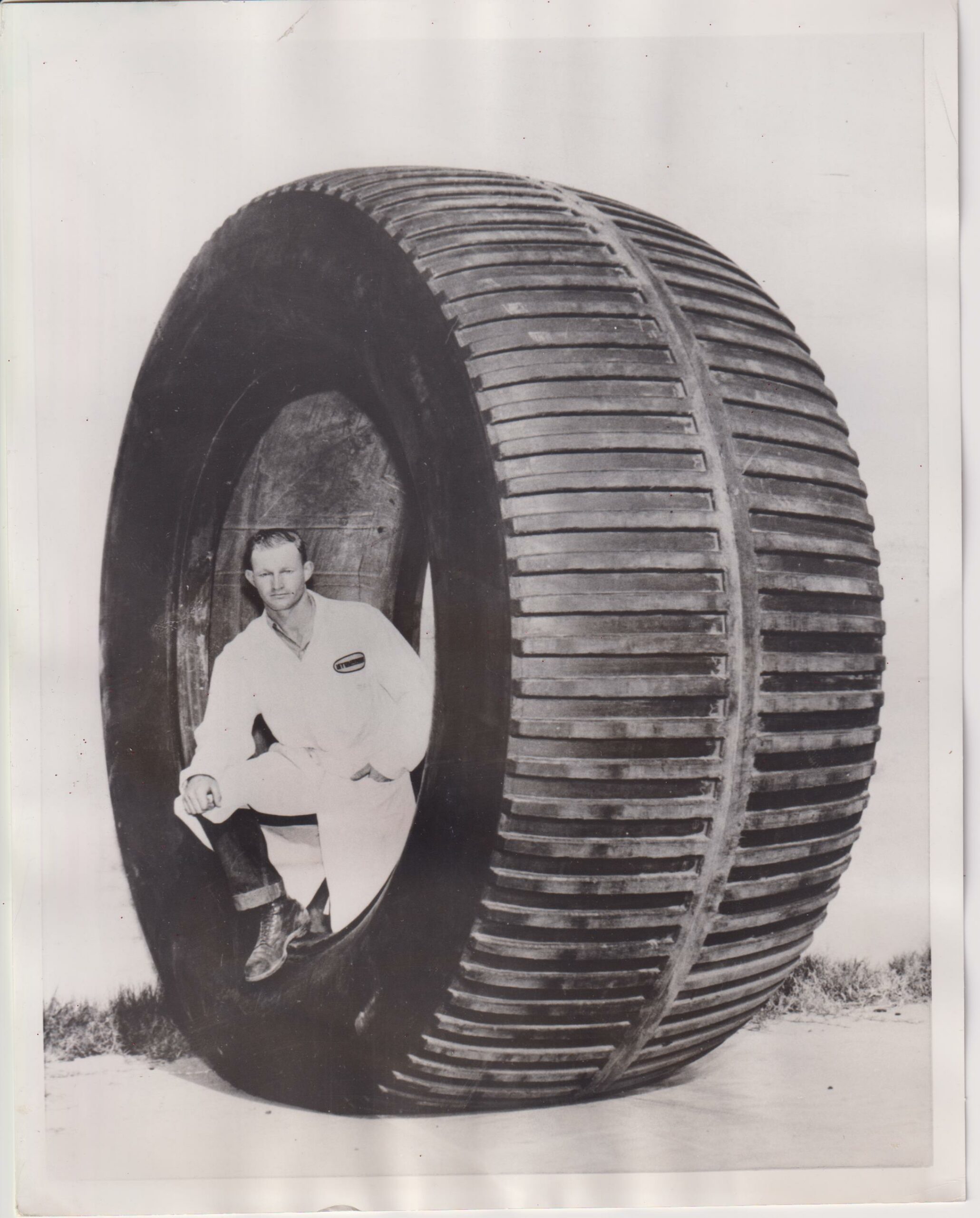 Man Inside Firestone 120x48x68 Tire – Overland Trains